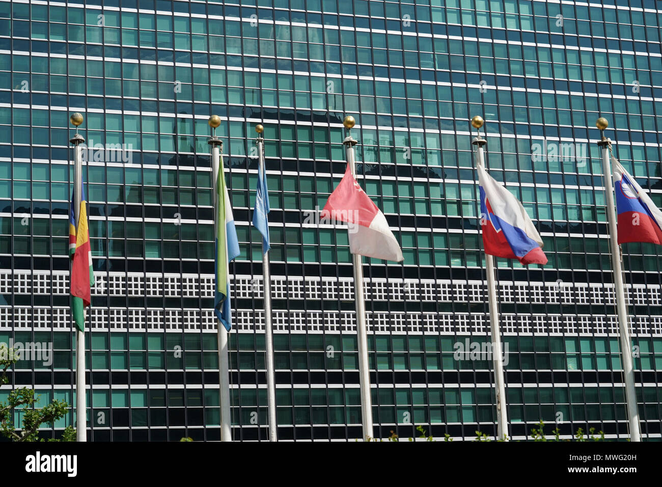 flags waving outside united nations building in manhattan new york ...