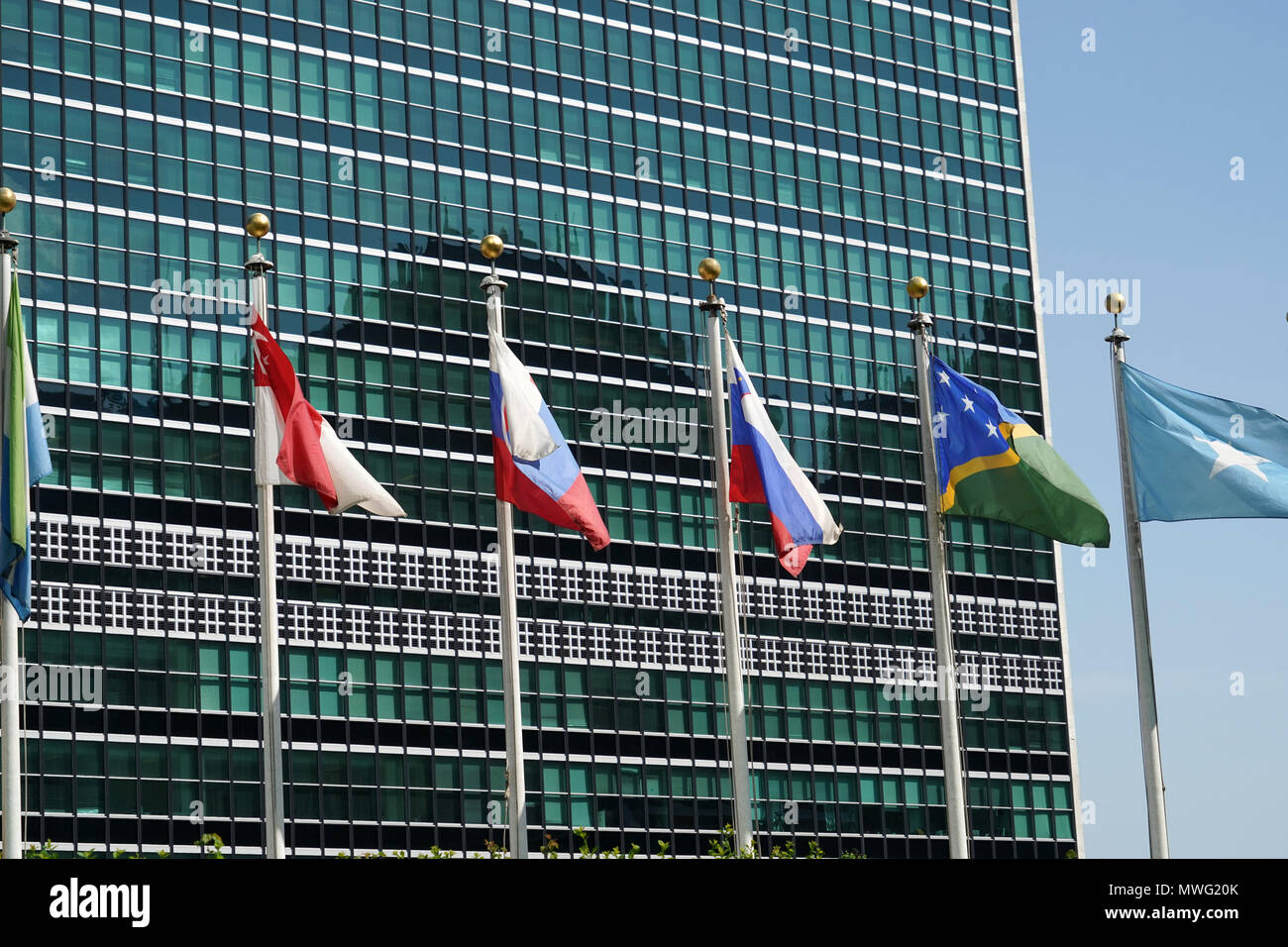 flags waving outside united nations building in manhattan new york ...