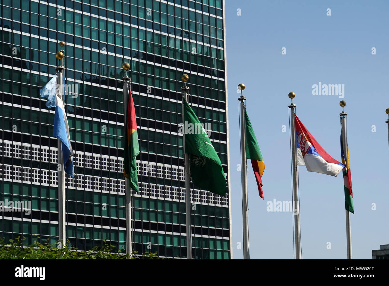 flags waving outside united nations building in manhattan new york ...