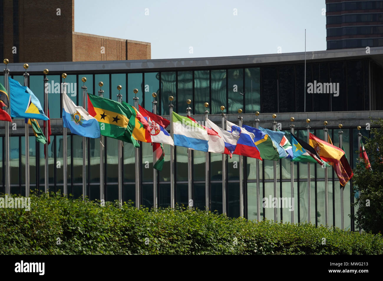 flags waving outside united nations building in manhattan new york ...