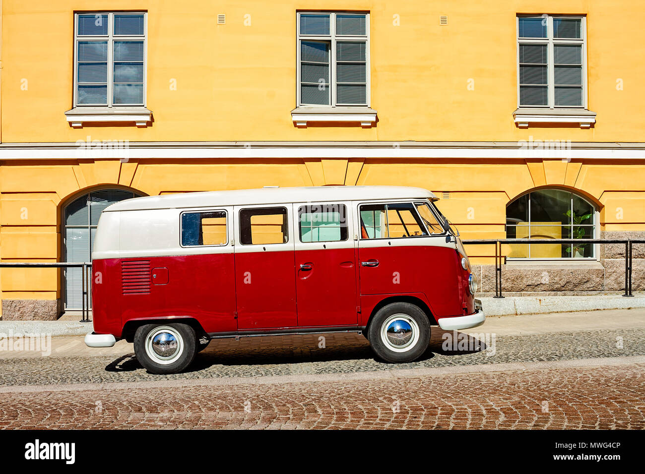 An old VW camper van has been parked by an old building in Oulu ...