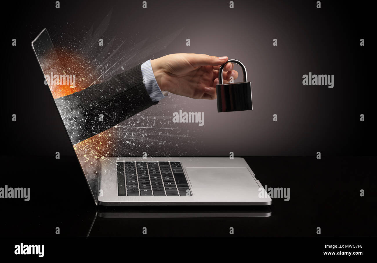 Hand with lock coming out of a laptop with sparkling effects Stock ...