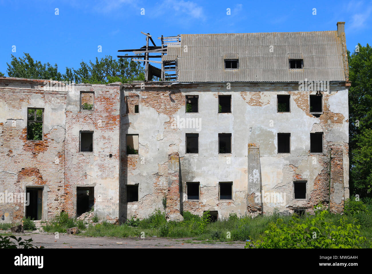An ancient ruined building on a bright sunny day. Ruined old castle ...