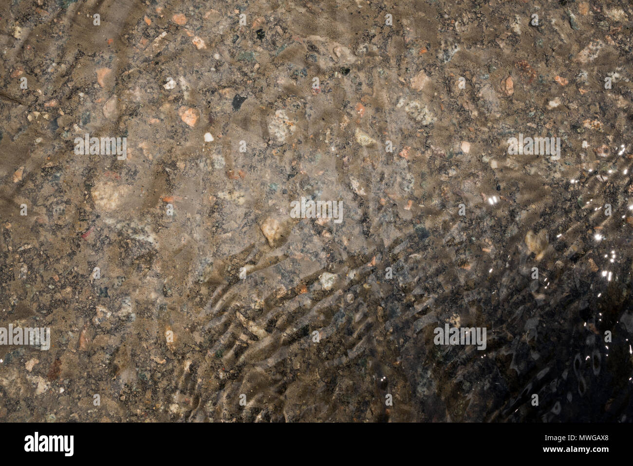 The texture of the bottom of the river is filled with stones ...