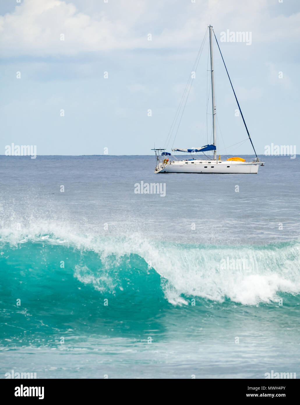 Sailing boat with Pacific Ocean breaking wave in foreground, Easter ...