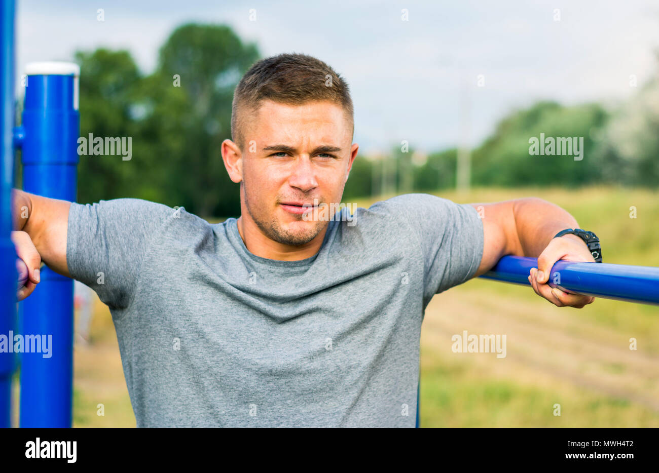 Man warming up before a street workout outdoors Stock Photo - Alamy