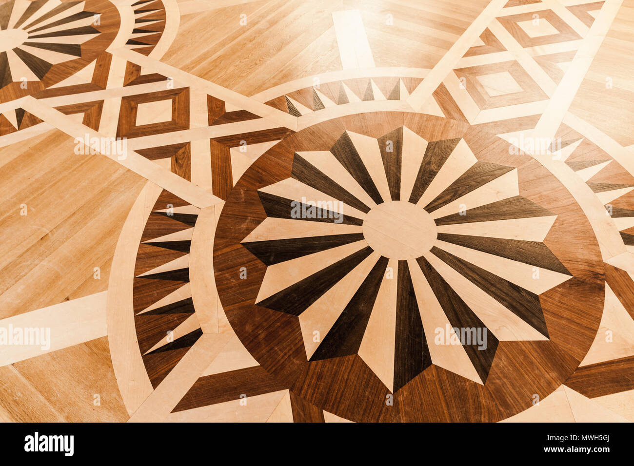 Old wooden parquet with round vintage pattern. Background photo texture ...