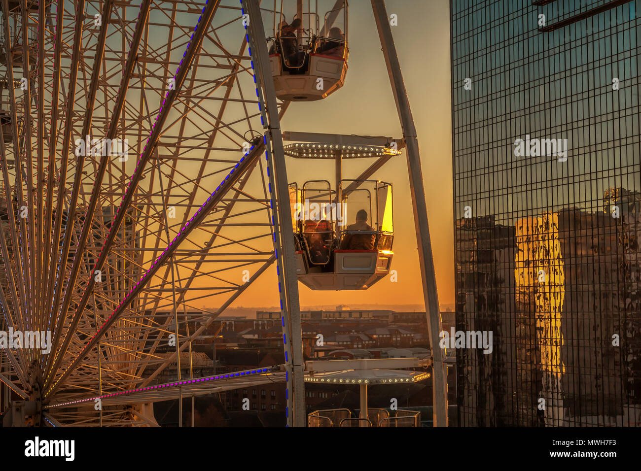 Ferris wheel reflected in the Birmingham Hyatt Hotel at sunset Stock ...