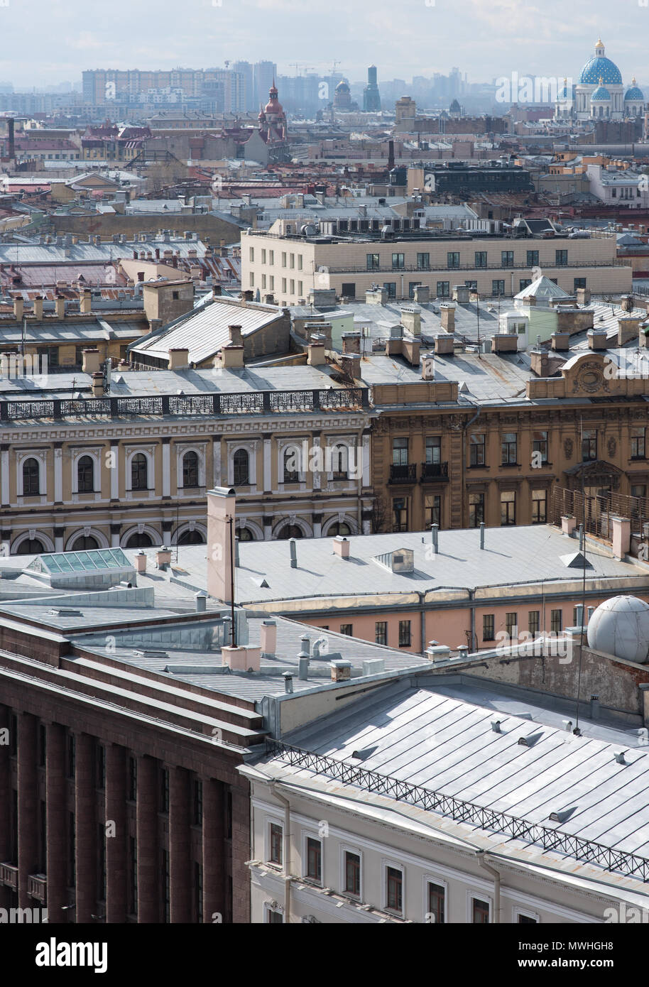 View of the city from a height. Buildings and rooftops, stretching to ...