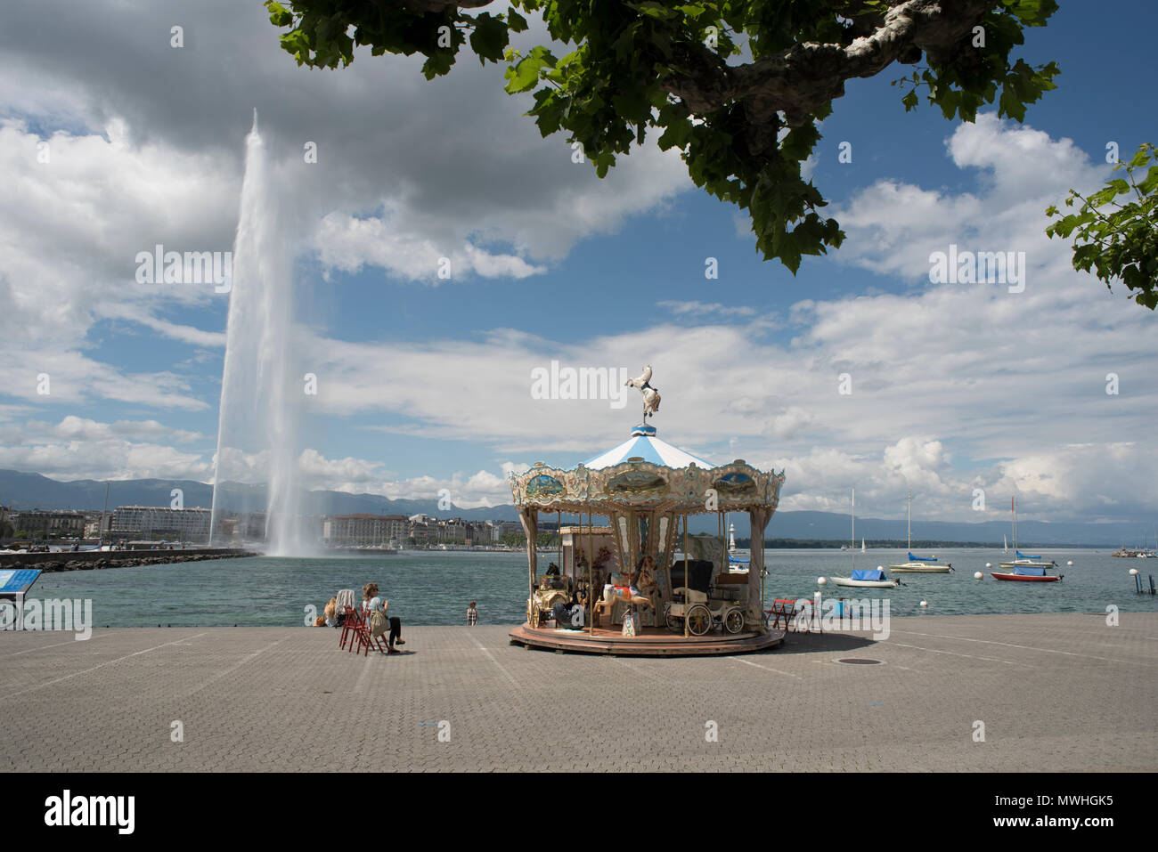 view of Geneva skyline with famous Jet d'Eau fountain at Lake Geneva ...