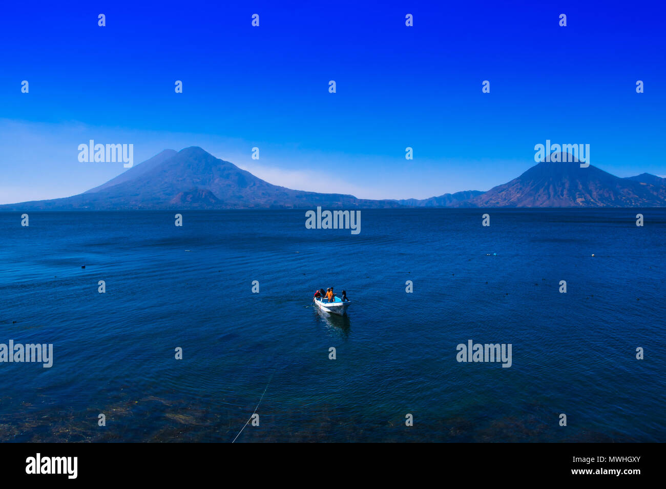 Beautiful outdoor view of small boats in Atitlan Lake is the deepest ...
