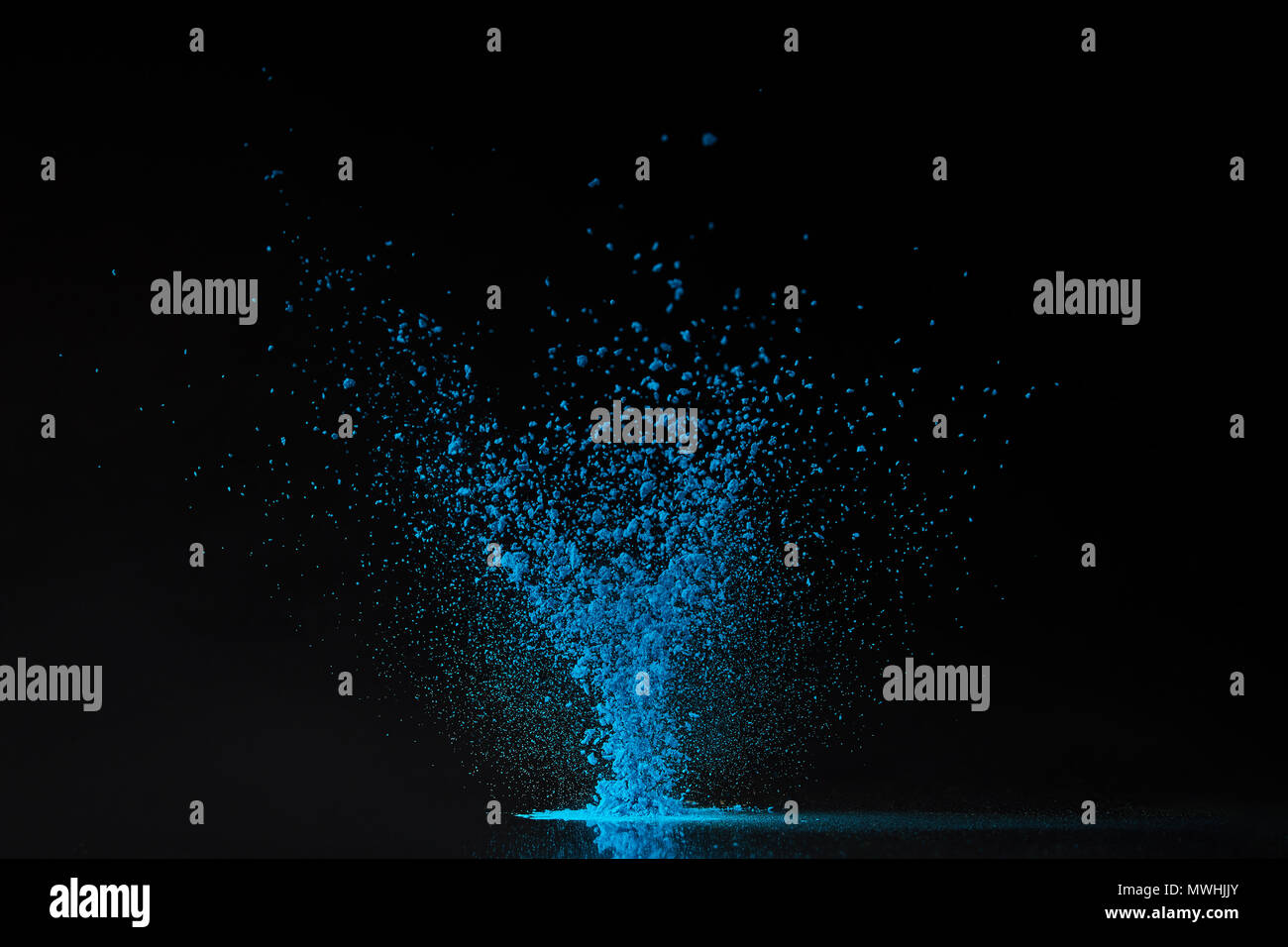 blue holi powder explosion on black Stock Photo - Alamy