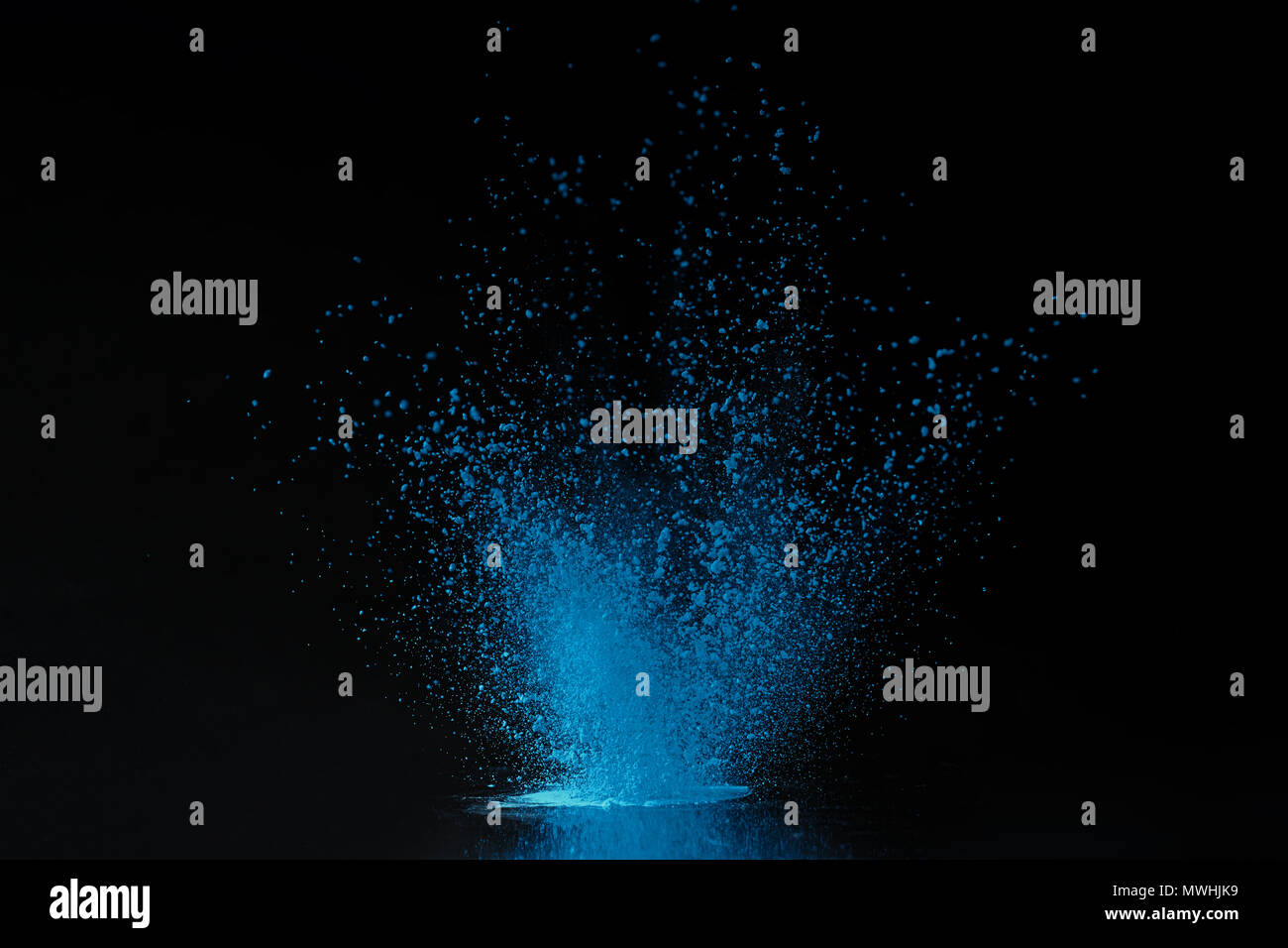 blue holi powder explosion on black, traditional Indian festival of ...