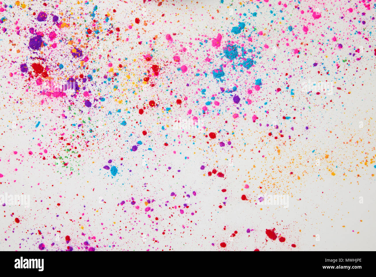 top view of scattered colorful holi powder isolated on white Stock ...