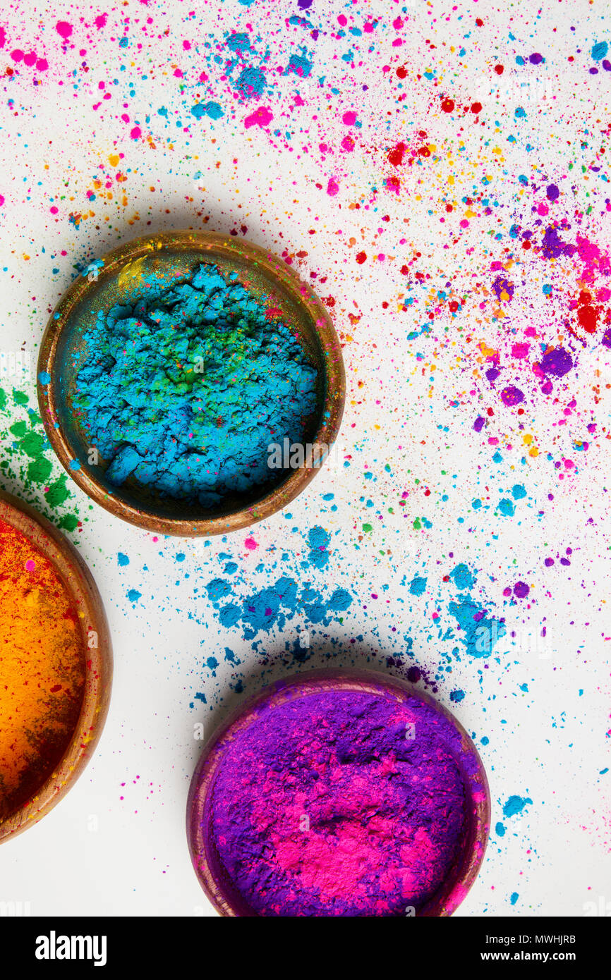 top view of colorful holi powder in bowls isolated on white Stock Photo ...