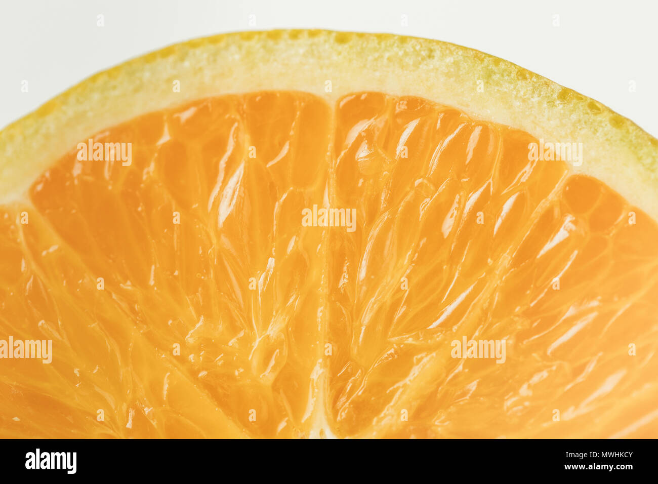 Close-up view of ripe orange fruit flesh isolated on white background ...