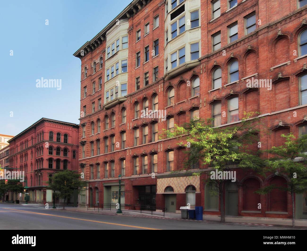 Quiet city street at sunrise Stock Photo - Alamy