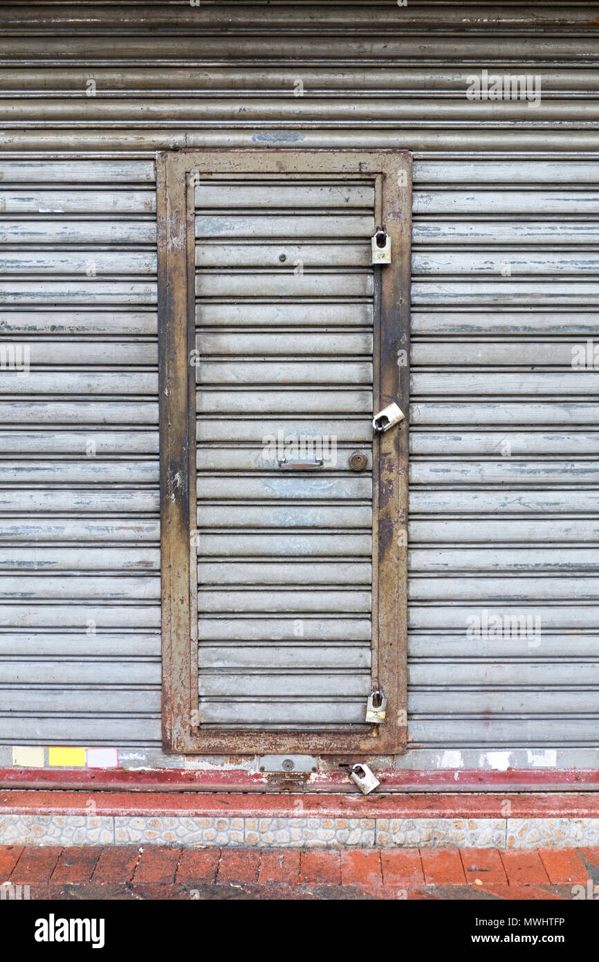 Locked Metal Door For Shop Protection Stock Photo - Alamy