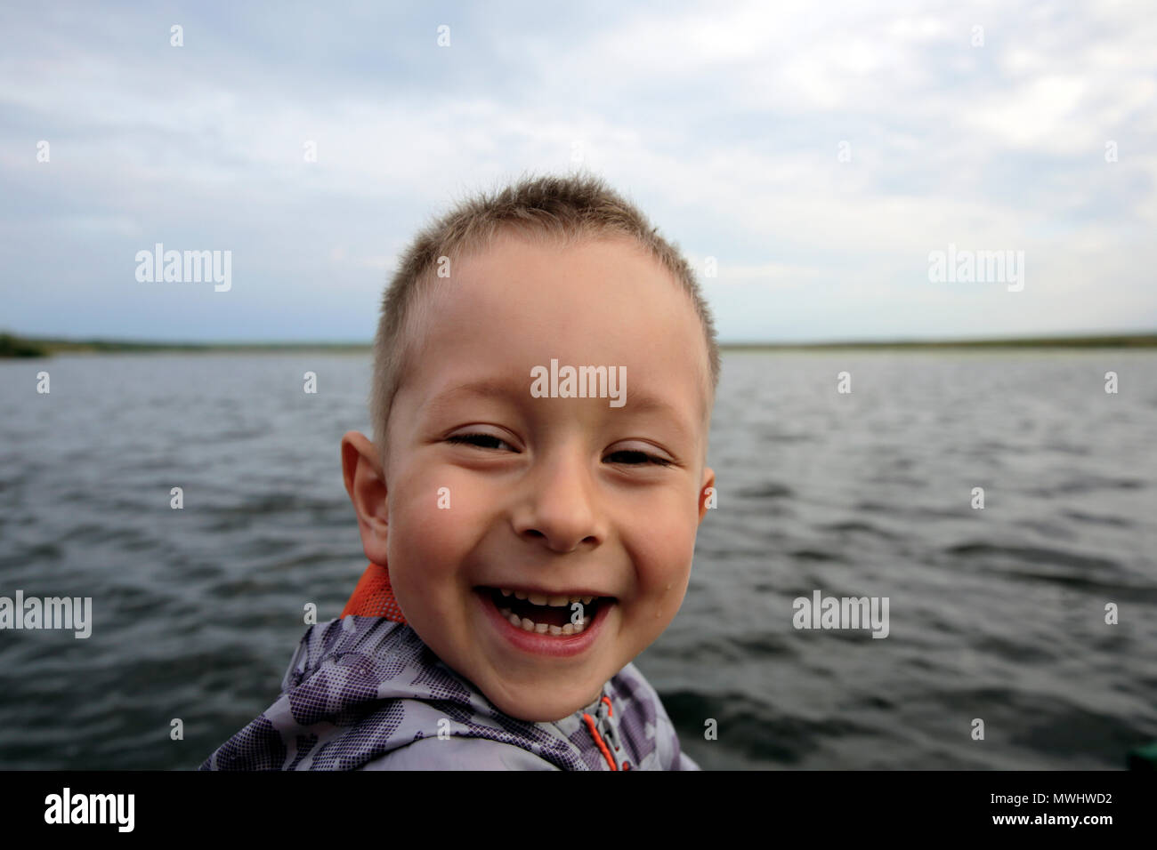 Cute smiling little boy outdoors Stock Photo - Alamy