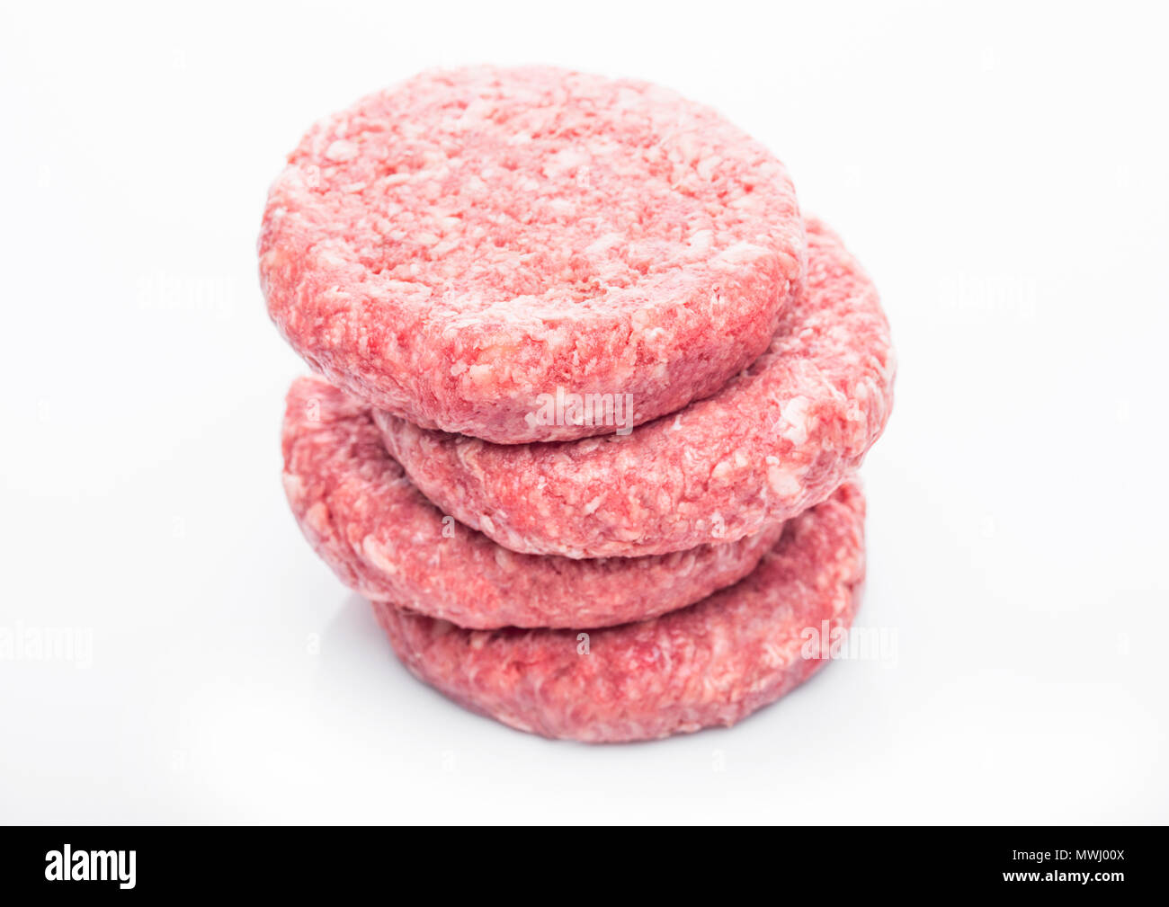 Raw fresh beef burgers on white background with reflection Stock Photo ...