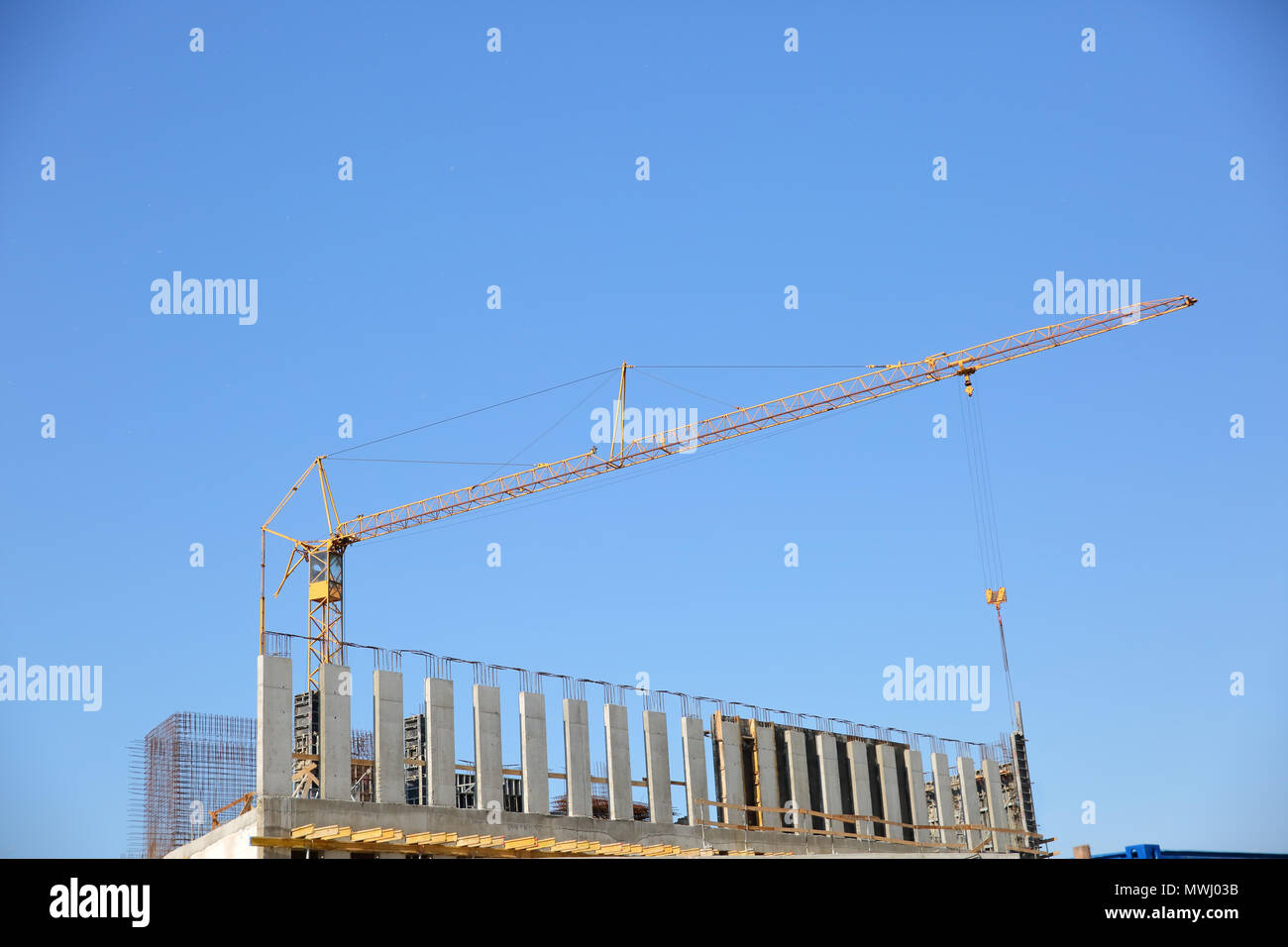 A construction crane is a tool for carrying large building materials to ...