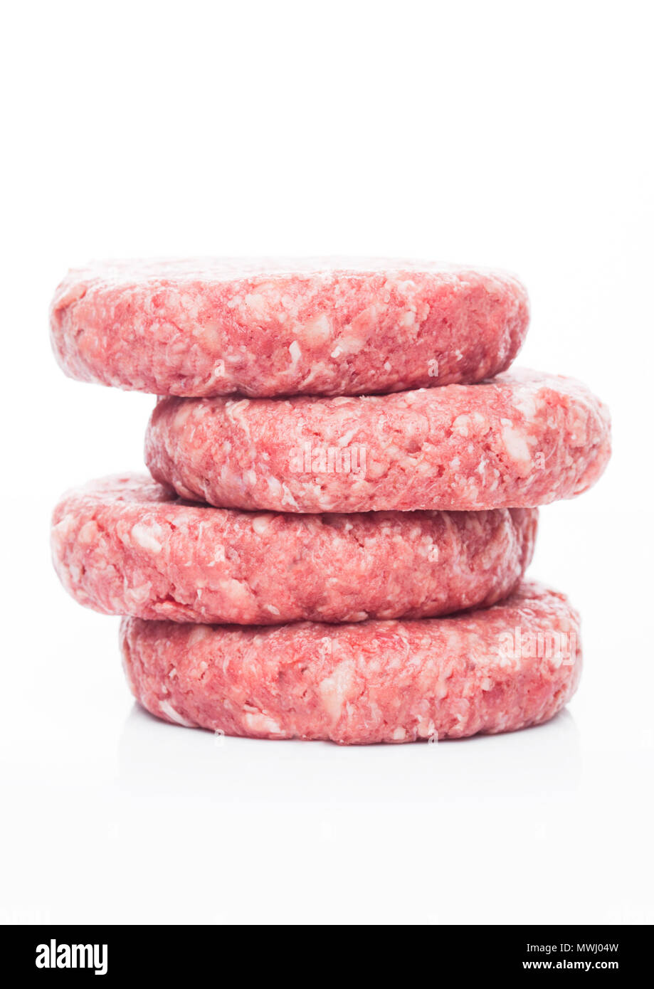 Raw fresh beef burgers on white background with reflection Stock Photo ...