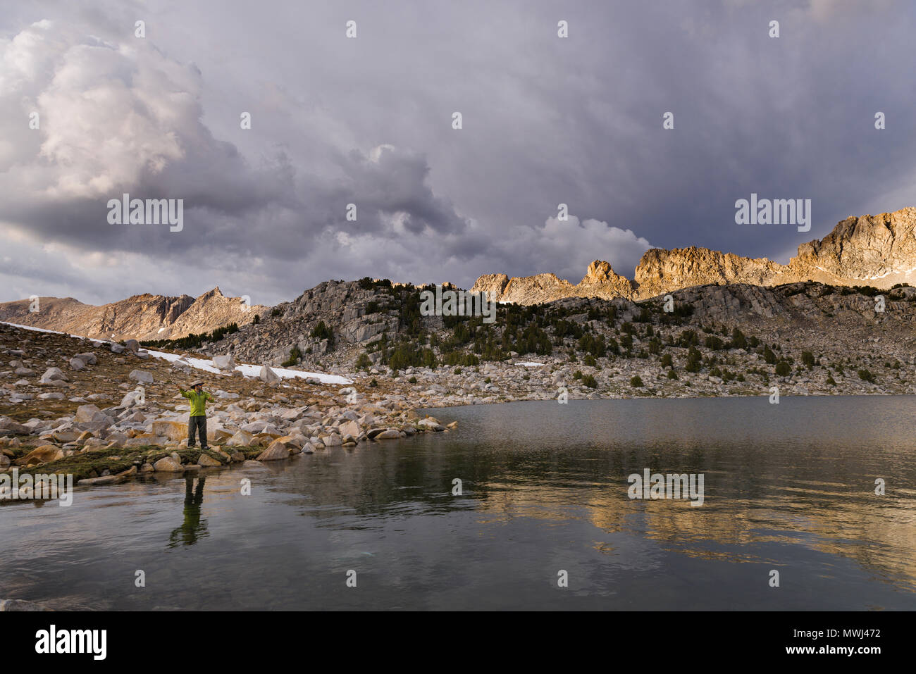 Sunset fly fishing at Steelhead Lake with storm clouds in the High ...