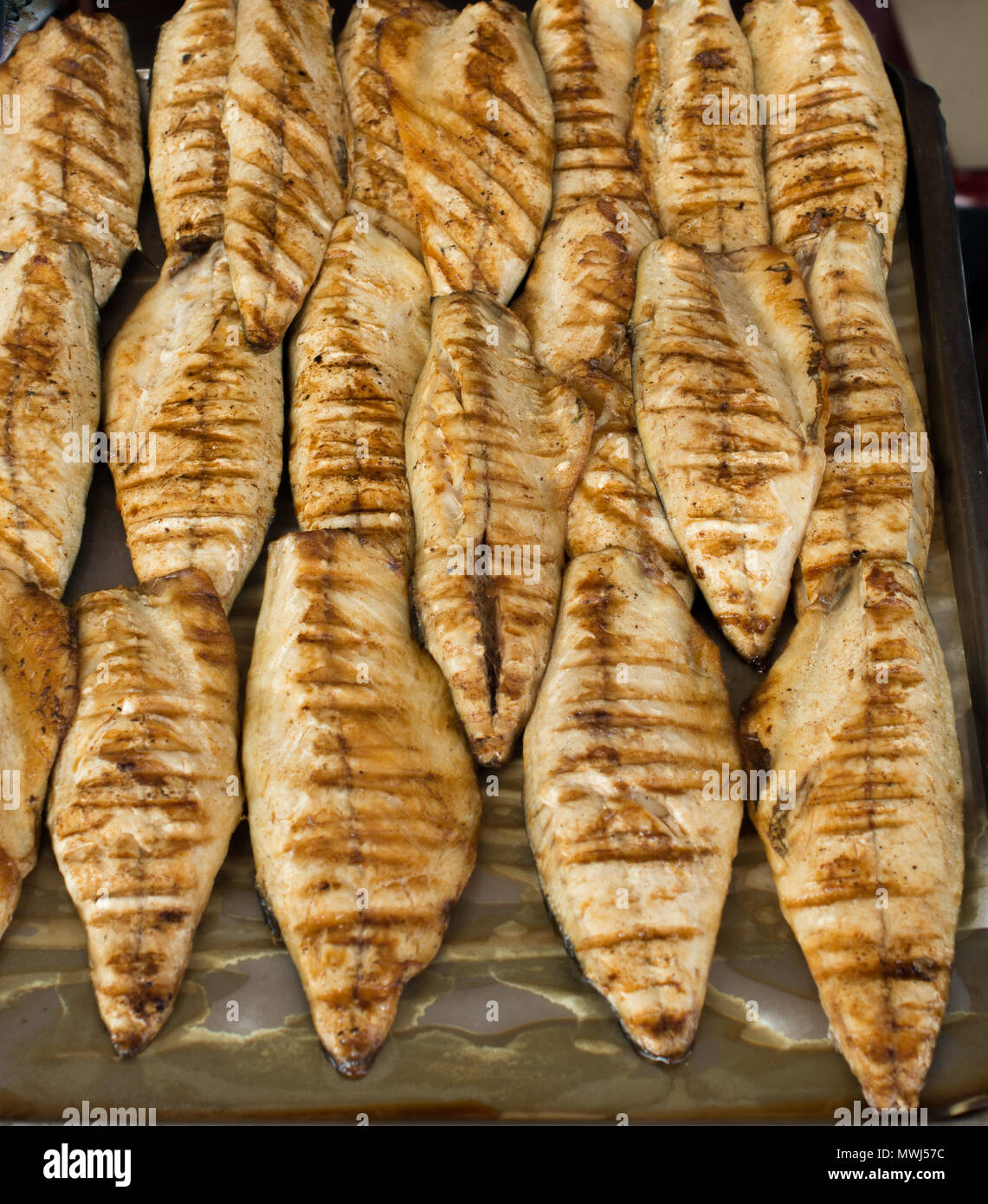 Fish on the grill as seafood ready to eat Stock Photo - Alamy