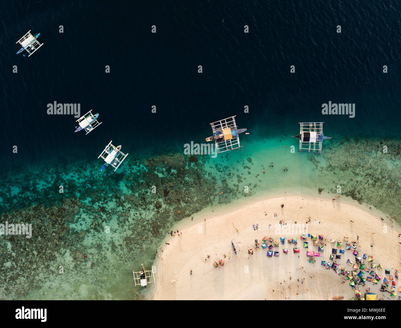 Philippine bunker boats near the White beach Stock Photo - Alamy