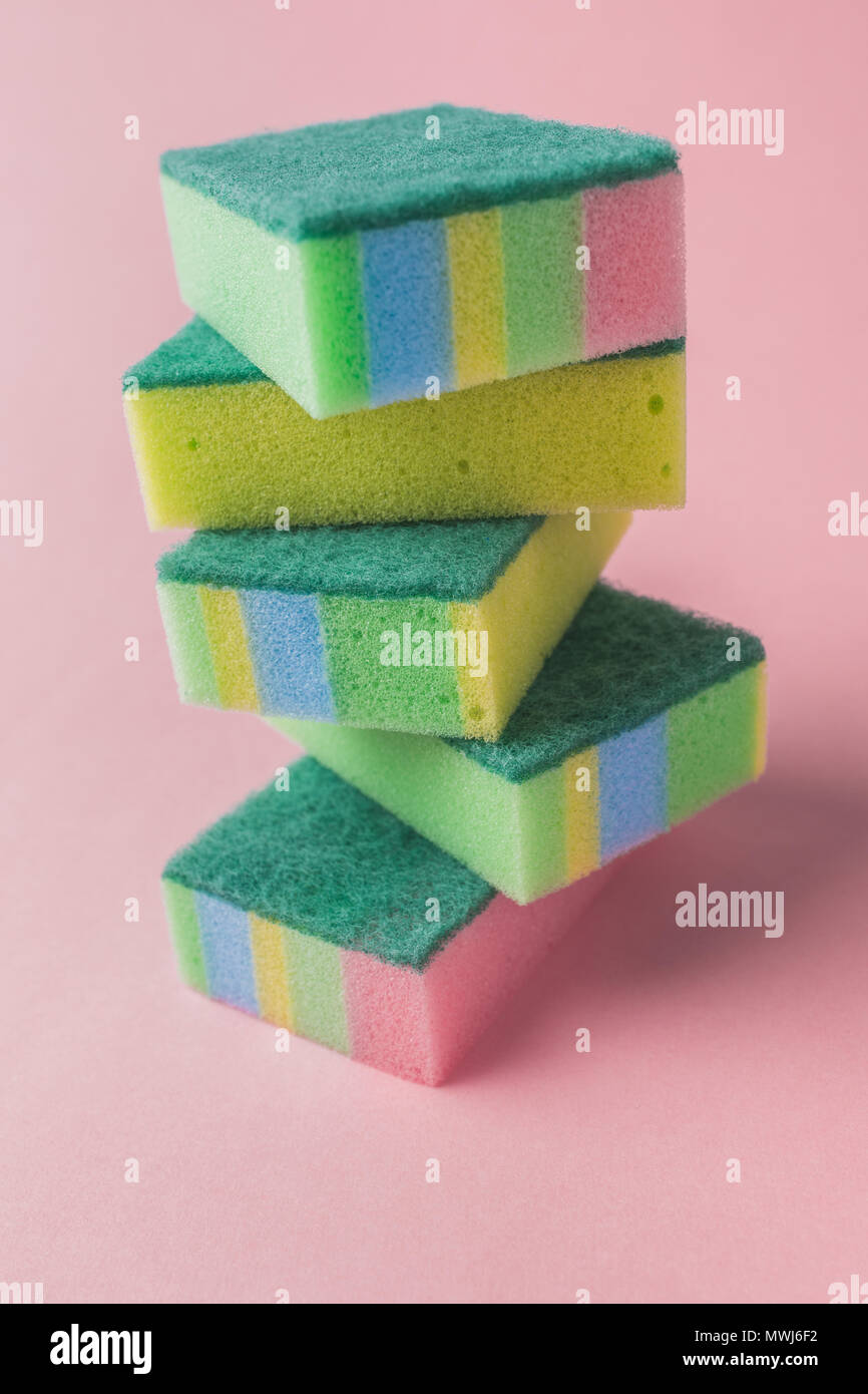 pile of colorful washing kitchen sponges, on pink Stock Photo - Alamy
