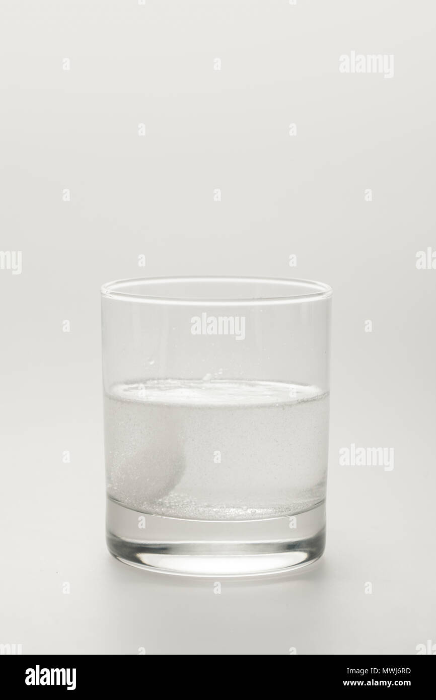 effervescent pill in glass of water isolated on white Stock Photo - Alamy