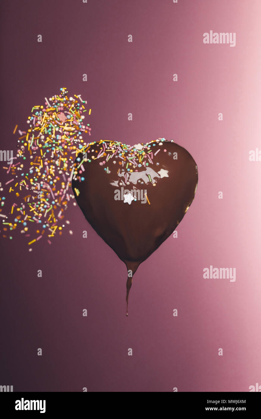 Pink heart symbol falling on hi-res stock photography and images - Alamy