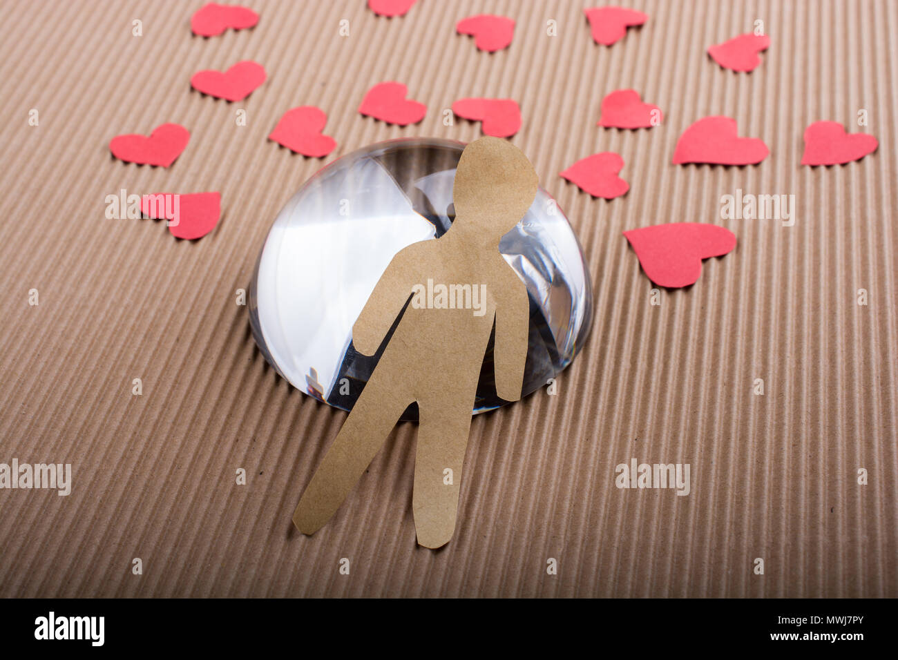 Man shape cut out of paper on paper background Stock Photo - Alamy