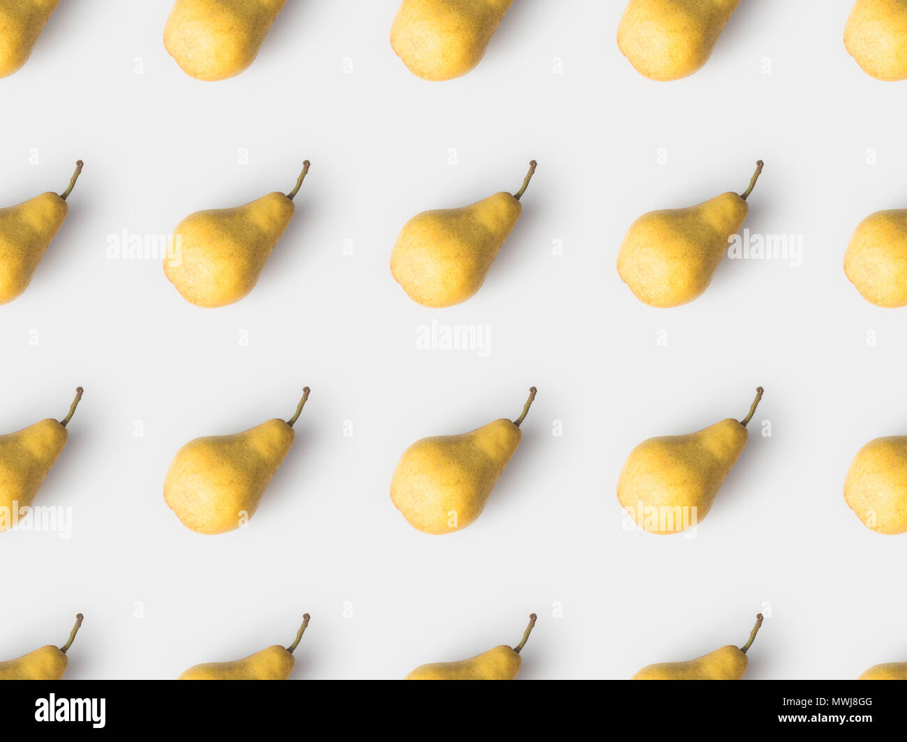 repetitive pattern of yellow pears isolated on white Stock Photo - Alamy