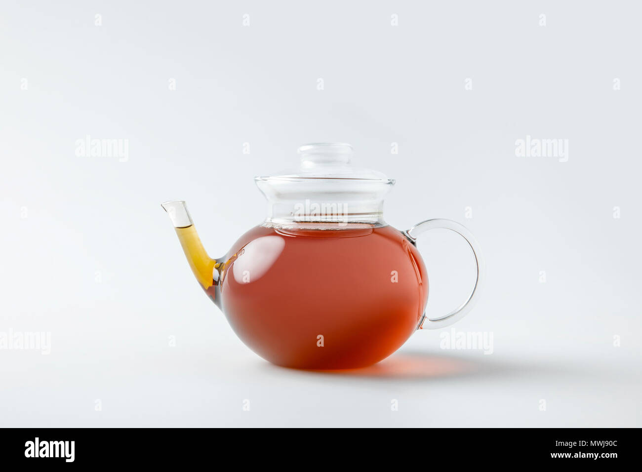 clear glass teapot with tea isolated on white Stock Photo - Alamy