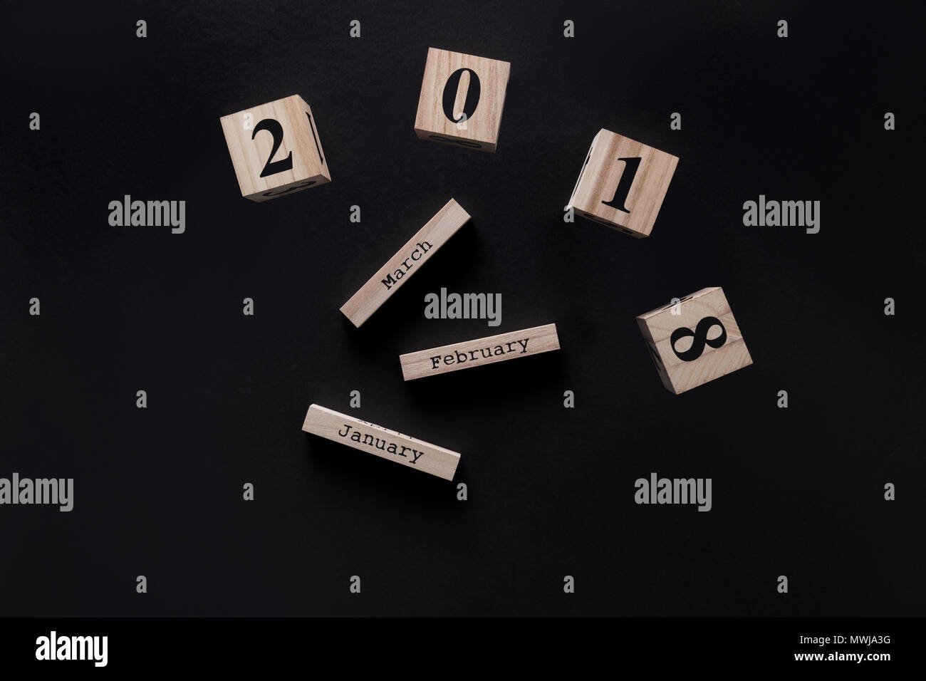 top view of parts of wooden calendar isolated on black Stock Photo - Alamy