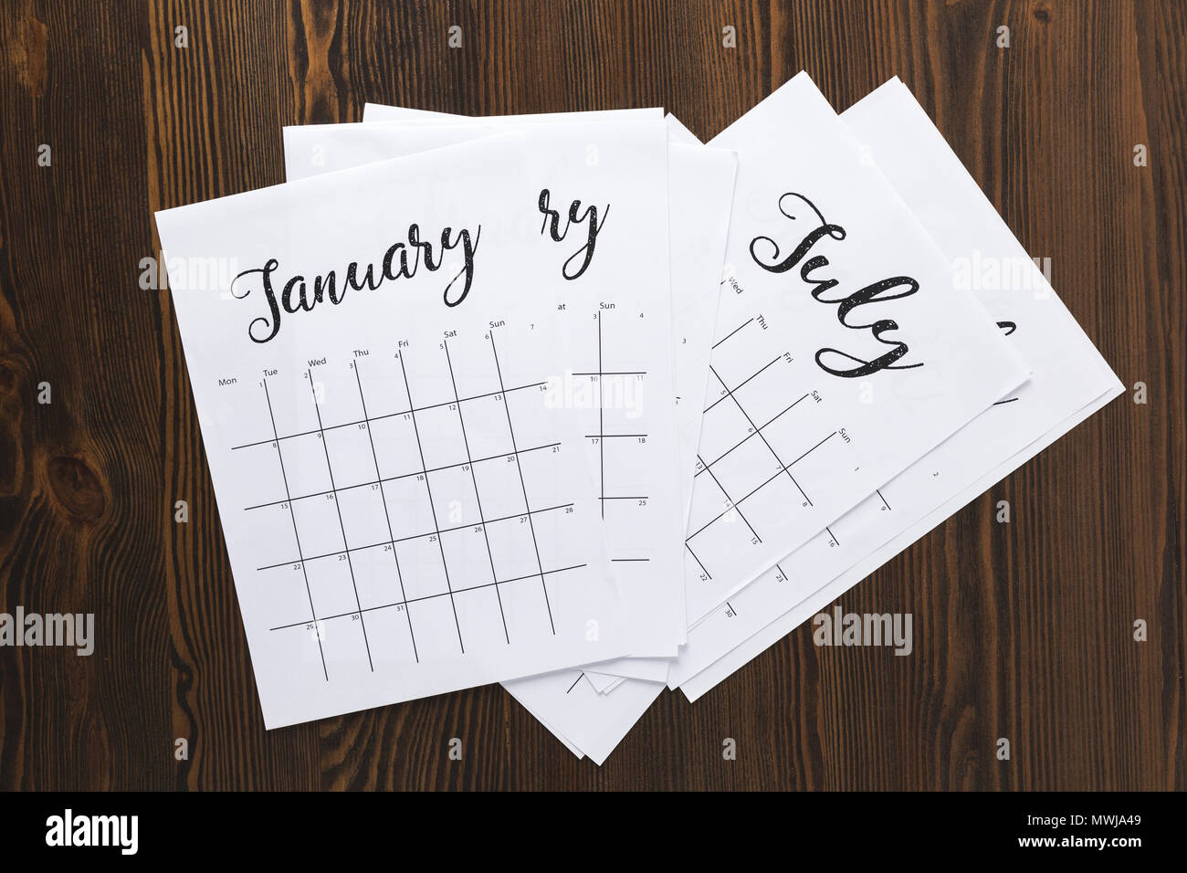 top view of pile of paper calendar parts on wooden tabletop Stock Photo ...