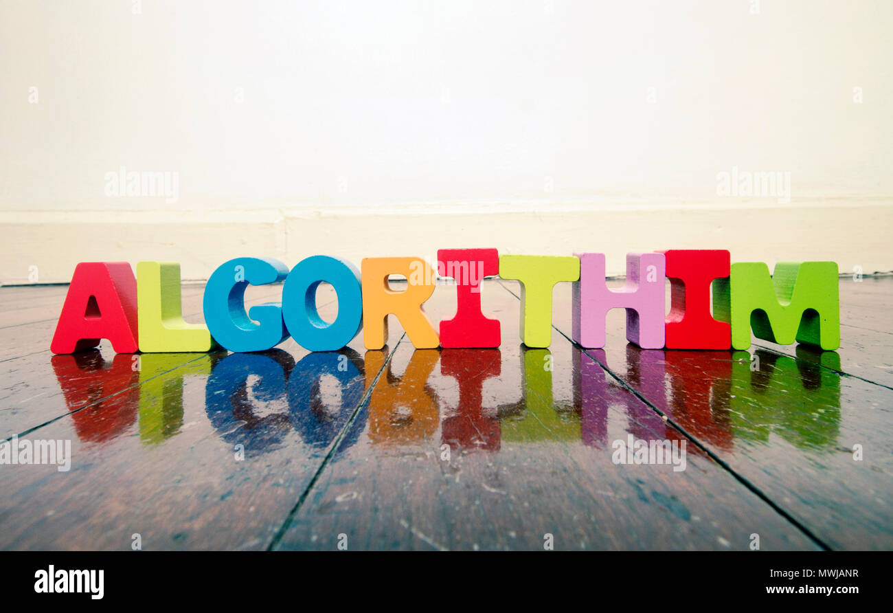 the word ALGORITHIM with wooden letters on an old wooden floor with ...