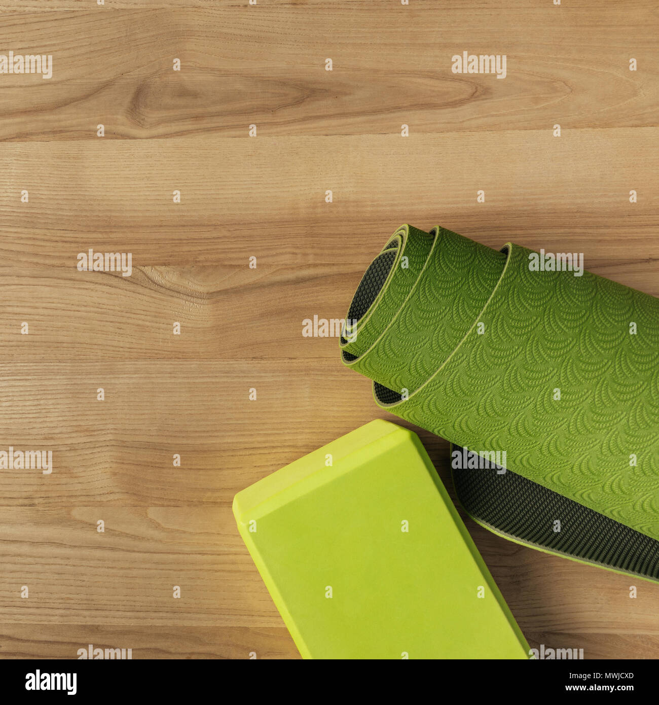 top view of green yoga mat on wooden floor Stock Photo - Alamy