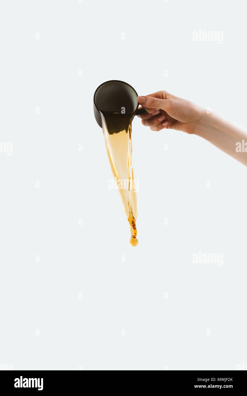 partial view of hand pouring out hot coffee, isolated on white Stock ...