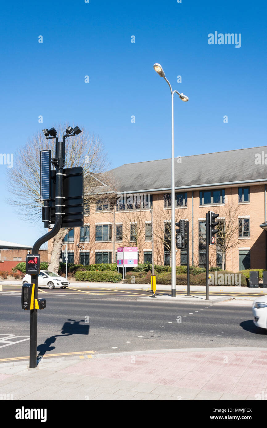 Solar powered pedestrian crossing signs and LED street lights Stock ...