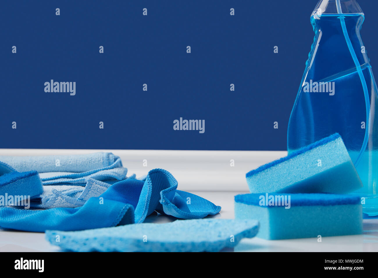 blue spray, rags and washing sponges for spring cleaning on floor Stock ...