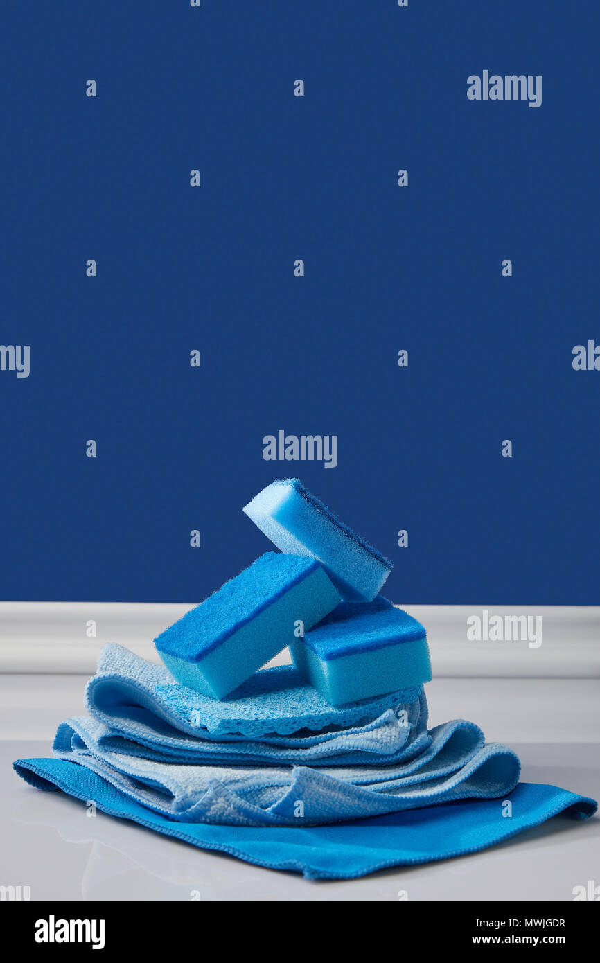 sponges and rags for spring cleaning on blue Stock Photo - Alamy