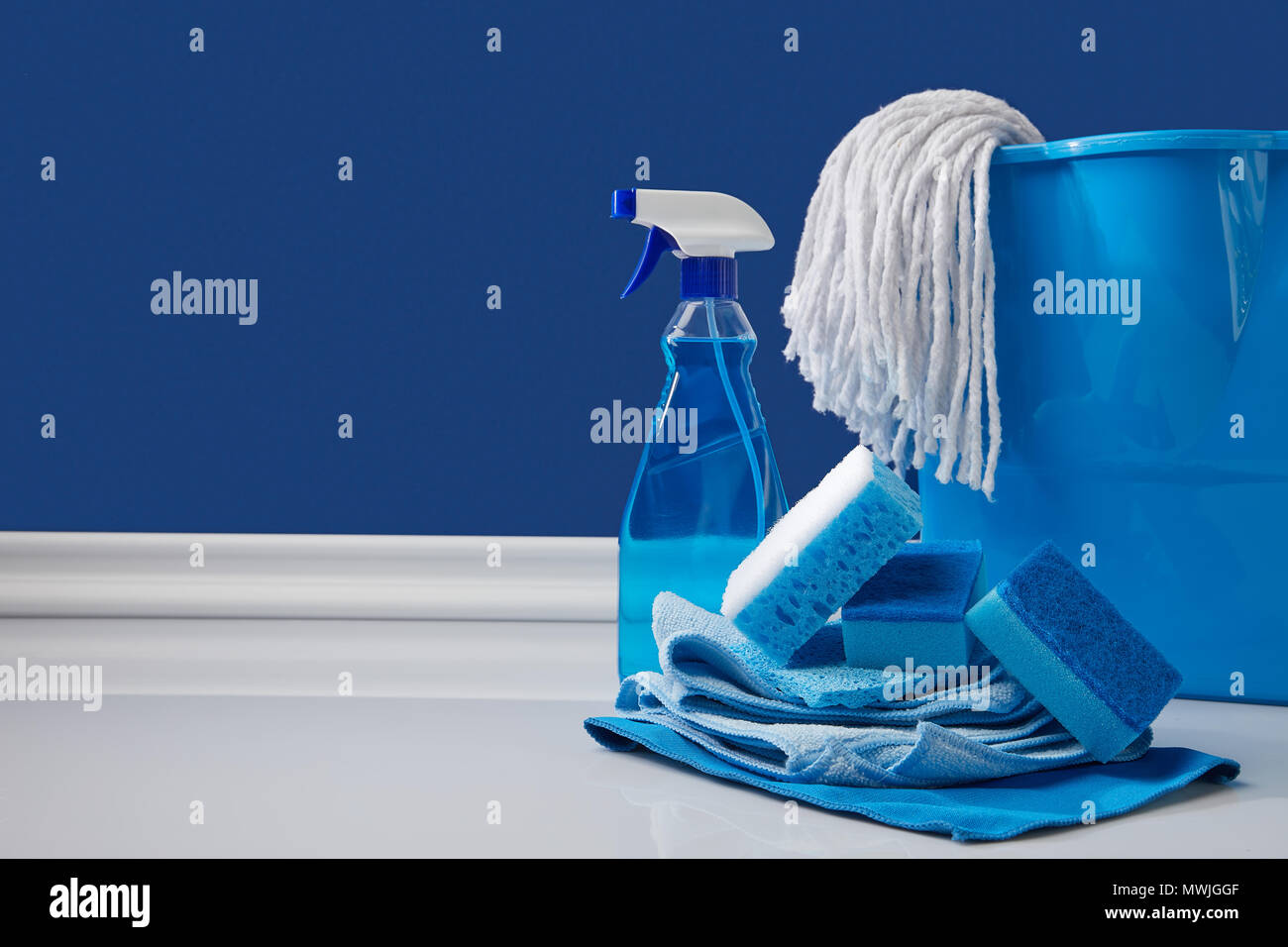 blue rags, bucket and spray for spring cleaning Stock Photo - Alamy