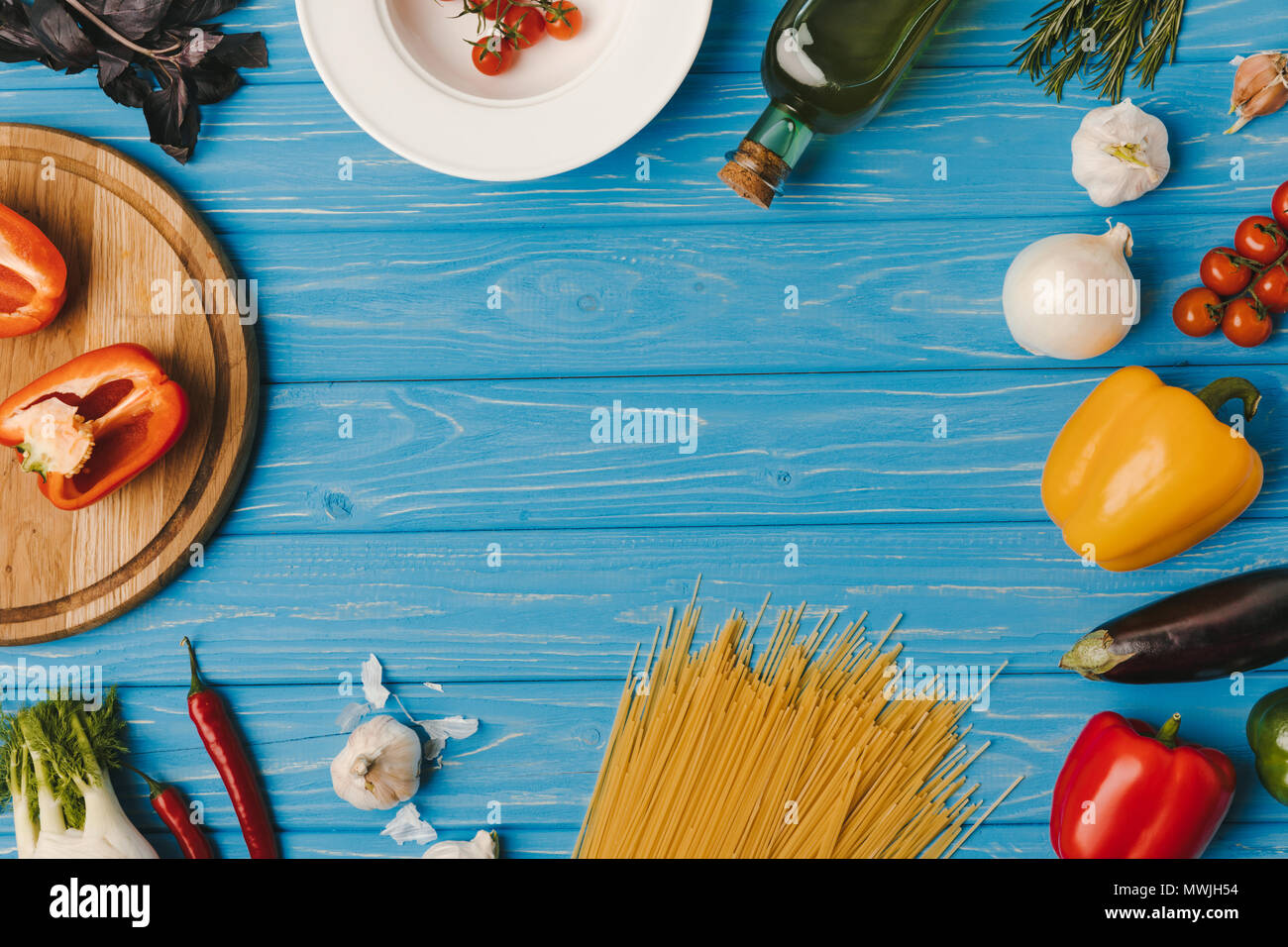 top view of blue table with pasta ingredients Stock Photo - Alamy