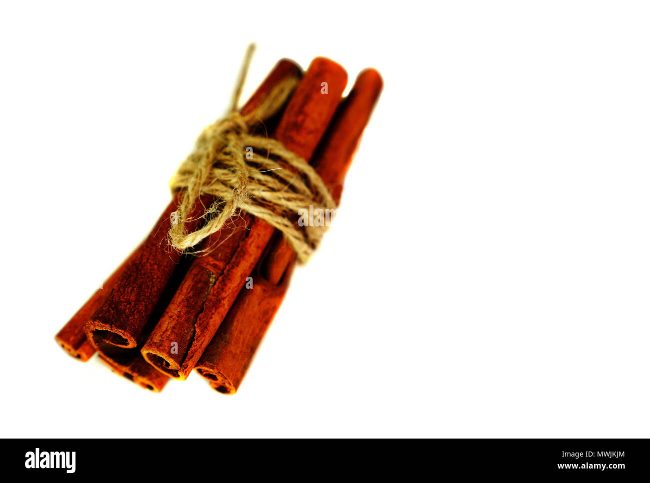 Cinnamon sticks tied with jute rope on isolated white background Stock ...