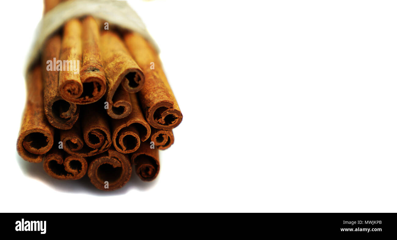 Cinnamon sticks tied with jute rope on isolated white background Stock ...