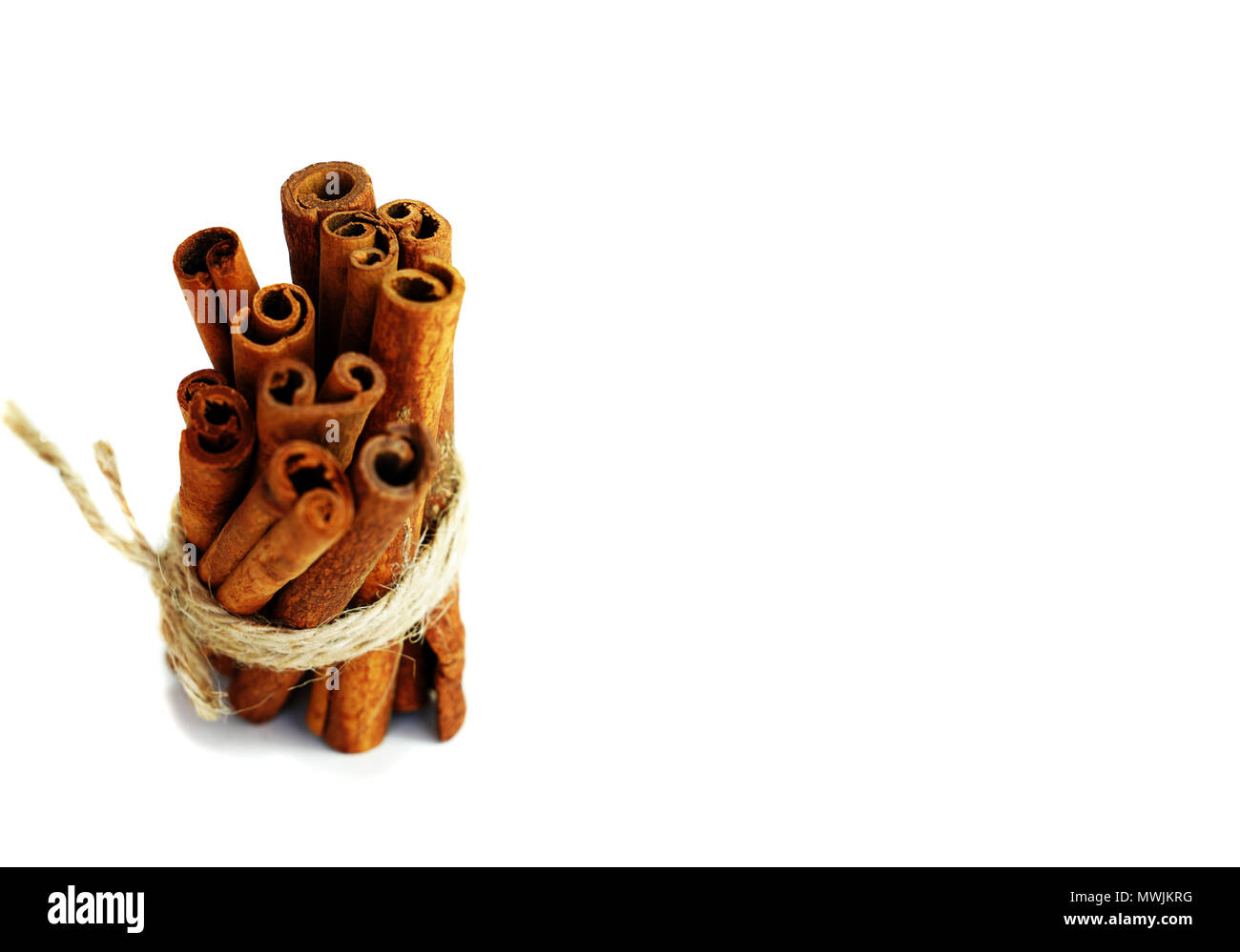 Cinnamon sticks tied with jute rope on isolated white background Stock ...