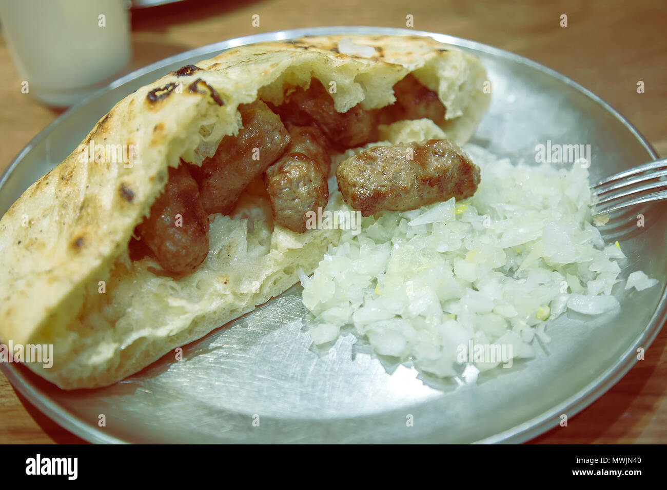 Cevapcici, Bosnian street food, cevapi in Sarajevo with onion and somun ...