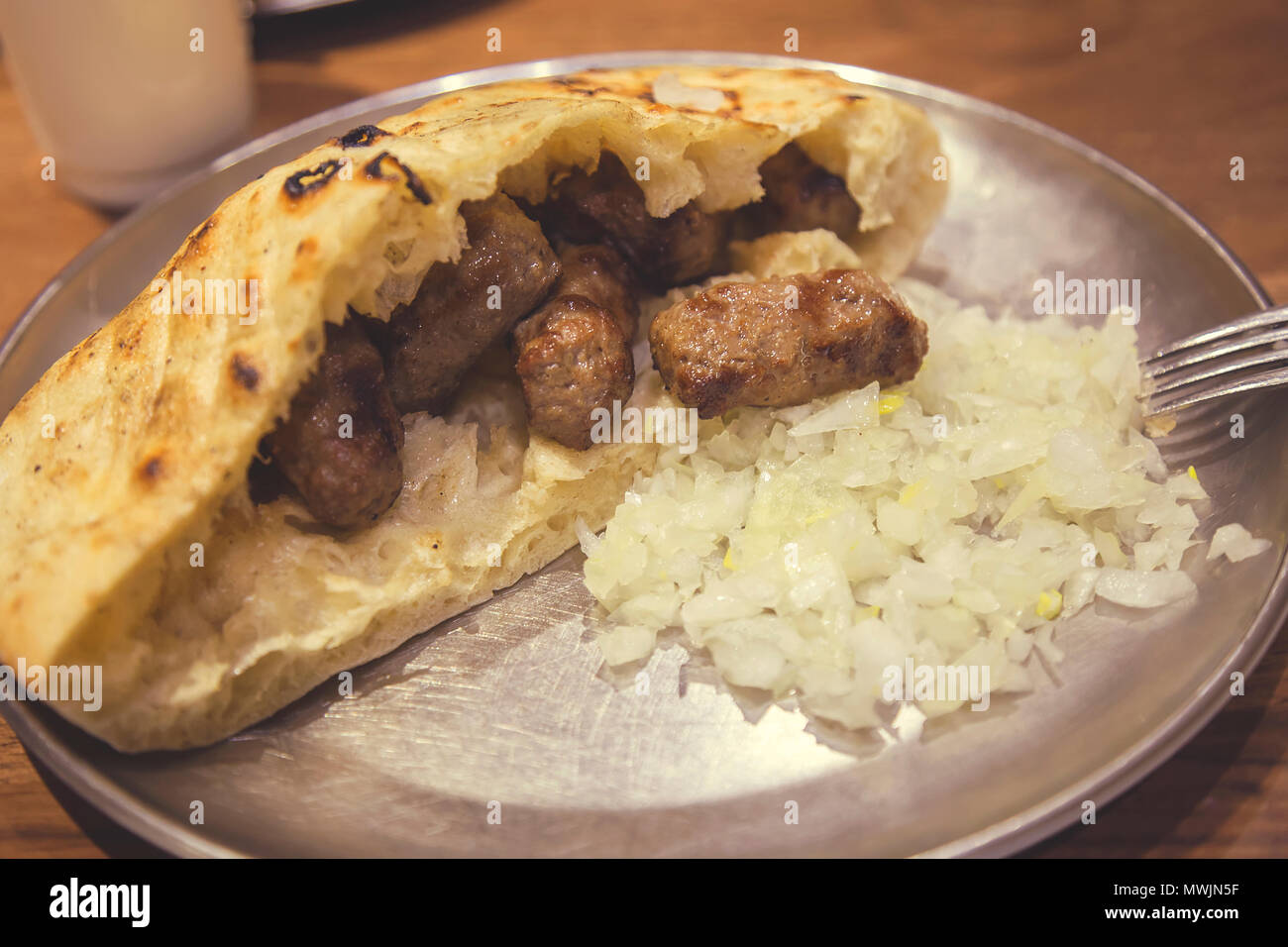 Cevapcici, Bosnian street food, cevapi in Sarajevo with onion and somun ...